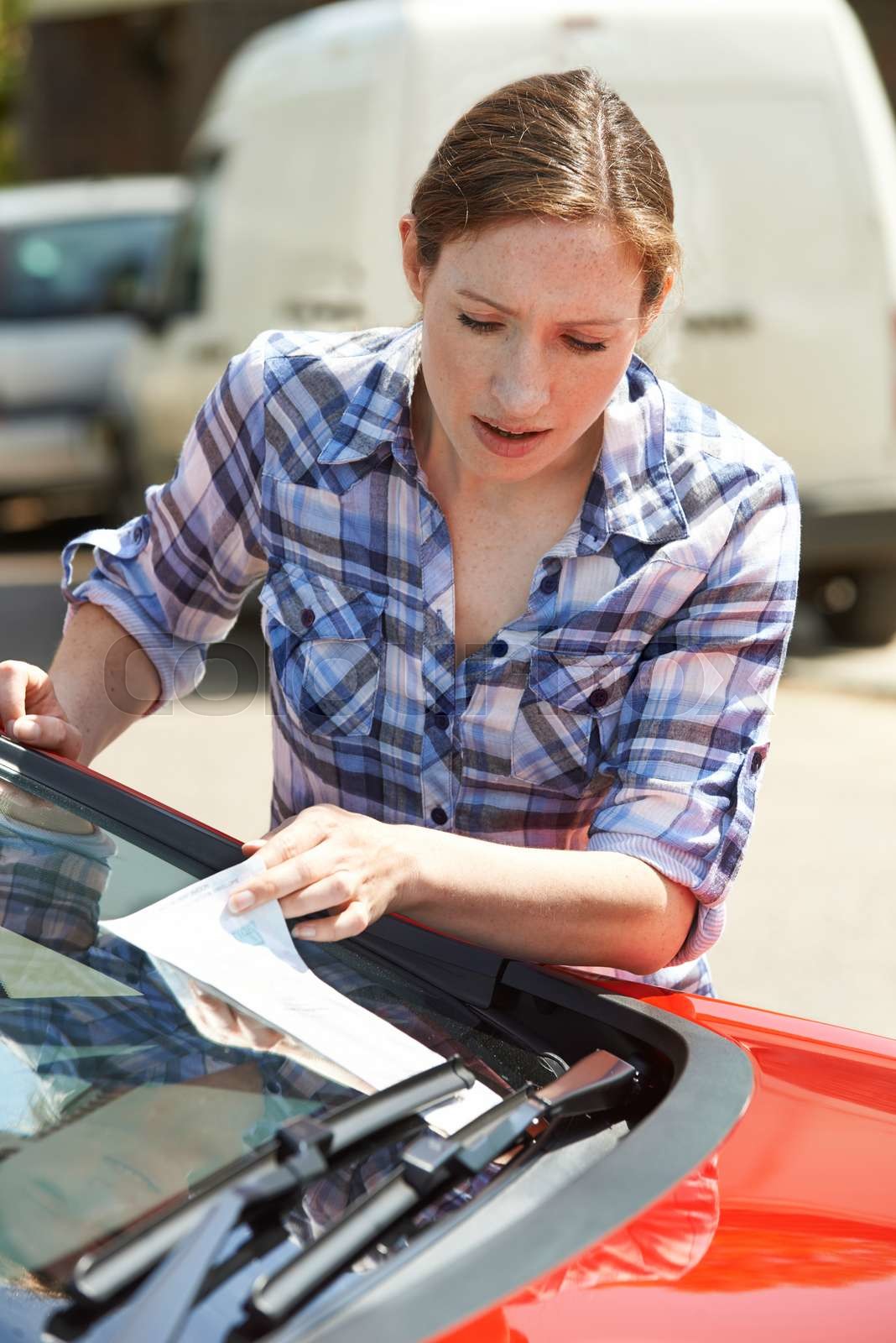 Frustrated Female Motorist Looking At Parking Ticket | Stock image ...