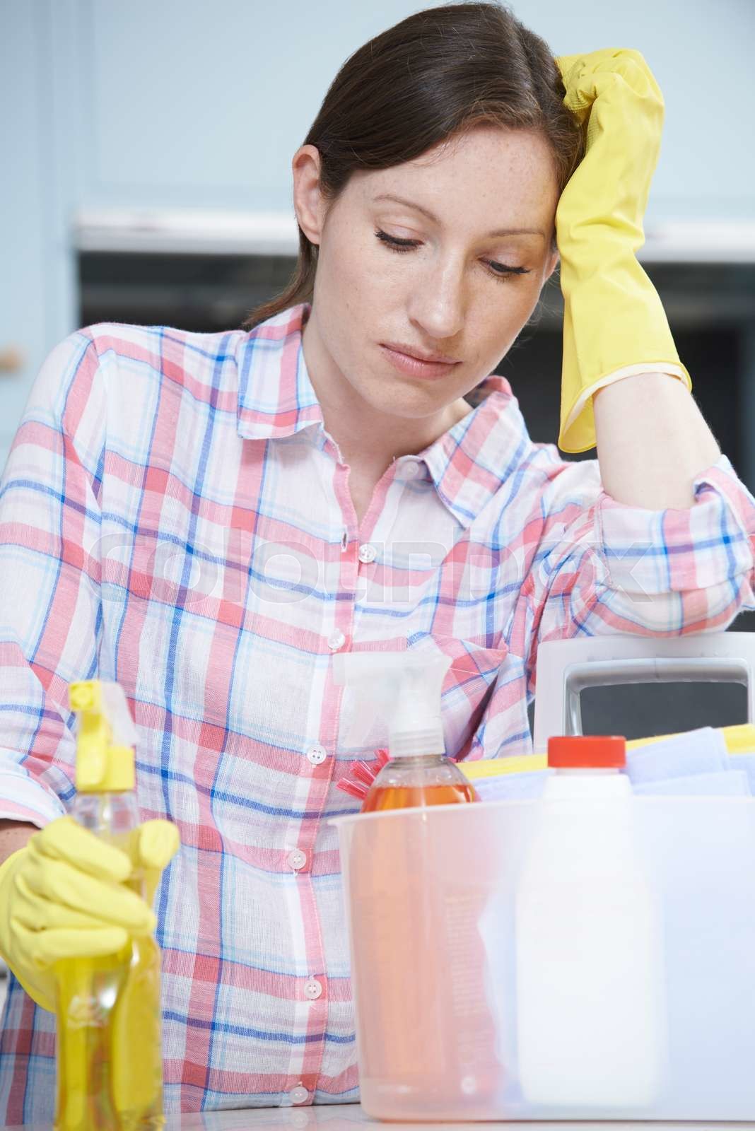 Unhappy Woman Surrounded By Cleaning Products At Home | Stock image ...