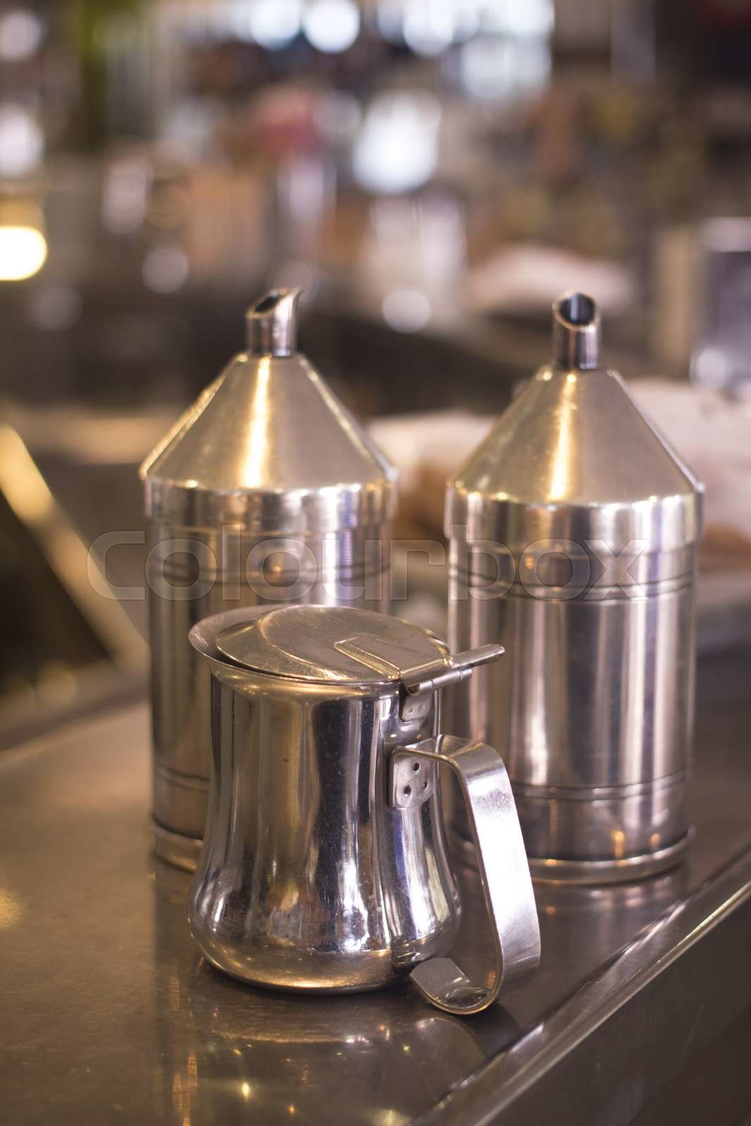 Coffee sugar milk dispensers in cafe bar | Stock image | Colourbox