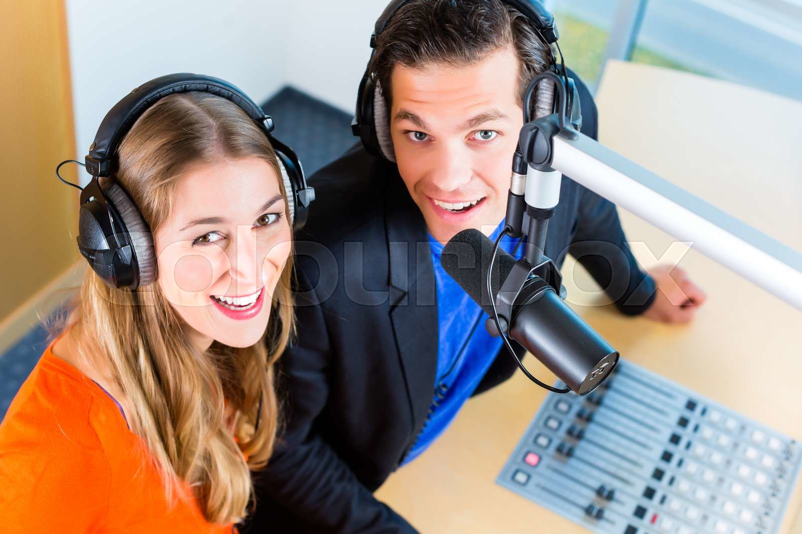 radio presenters in radio station on air | Stock image | Colourbox
