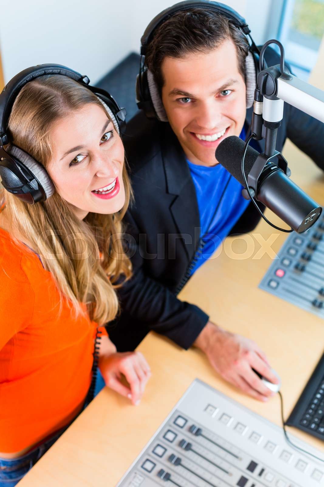 radio presenters in radio station on air | Stock image | Colourbox