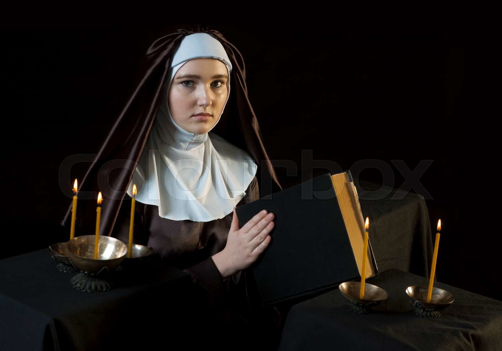 Nun with bible. | Stock image | Colourbox