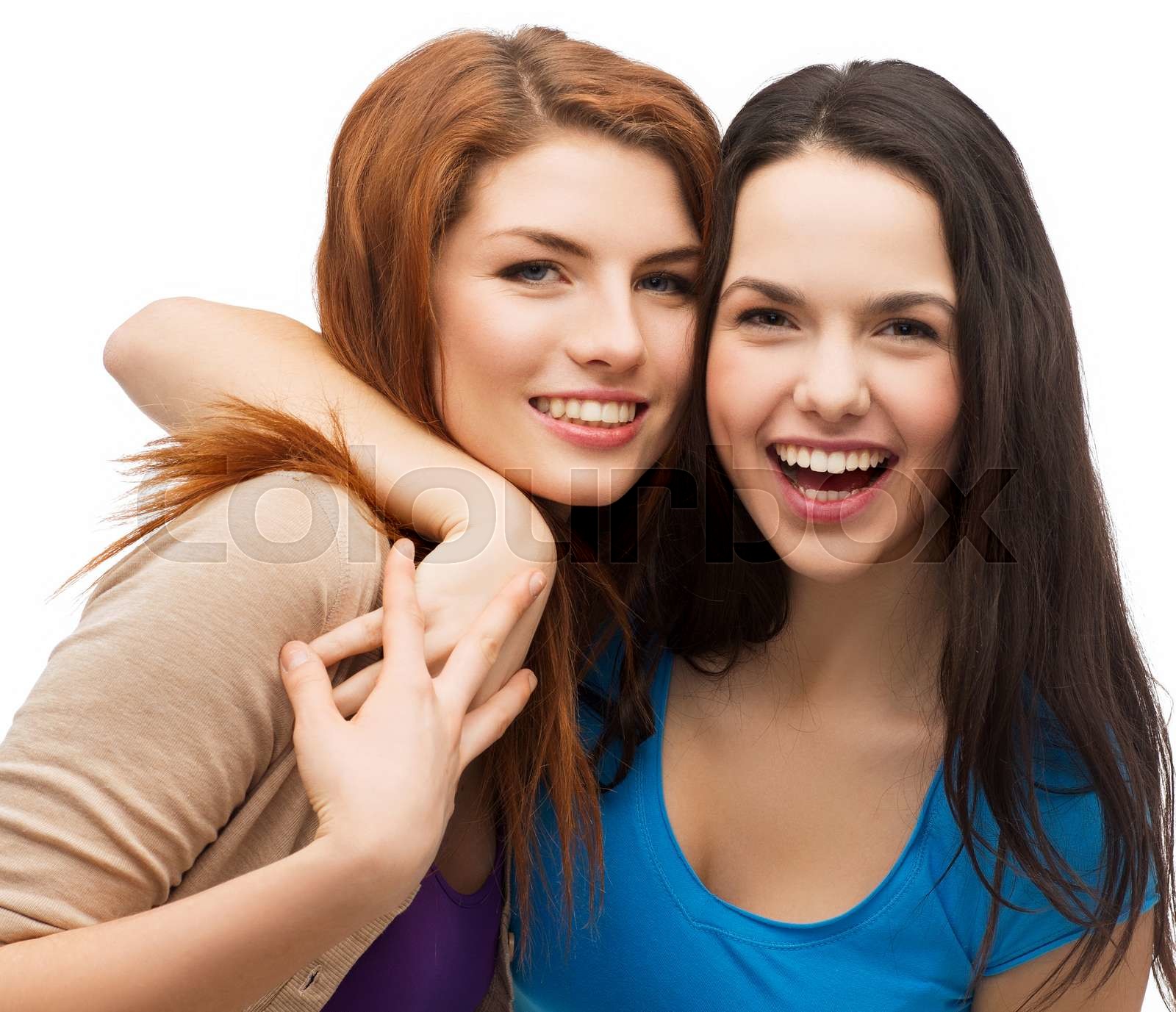 two laughing girls hugging | Stock image | Colourbox