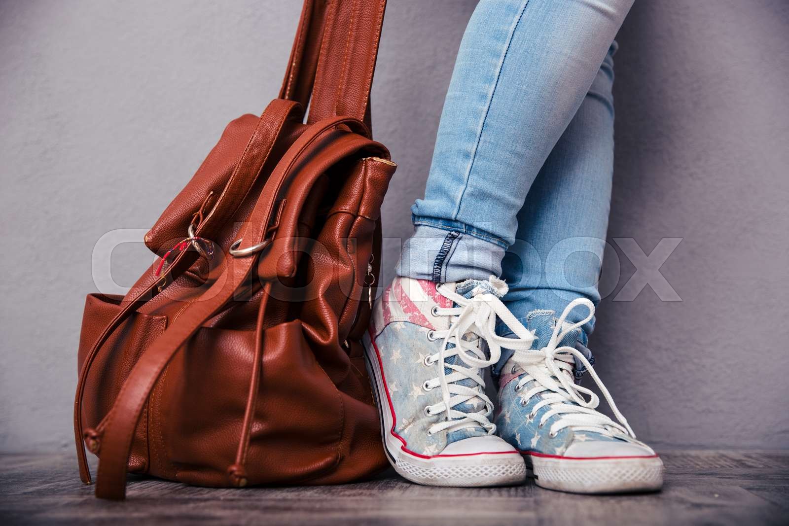 Female legs with leather backpack | Stock image | Colourbox