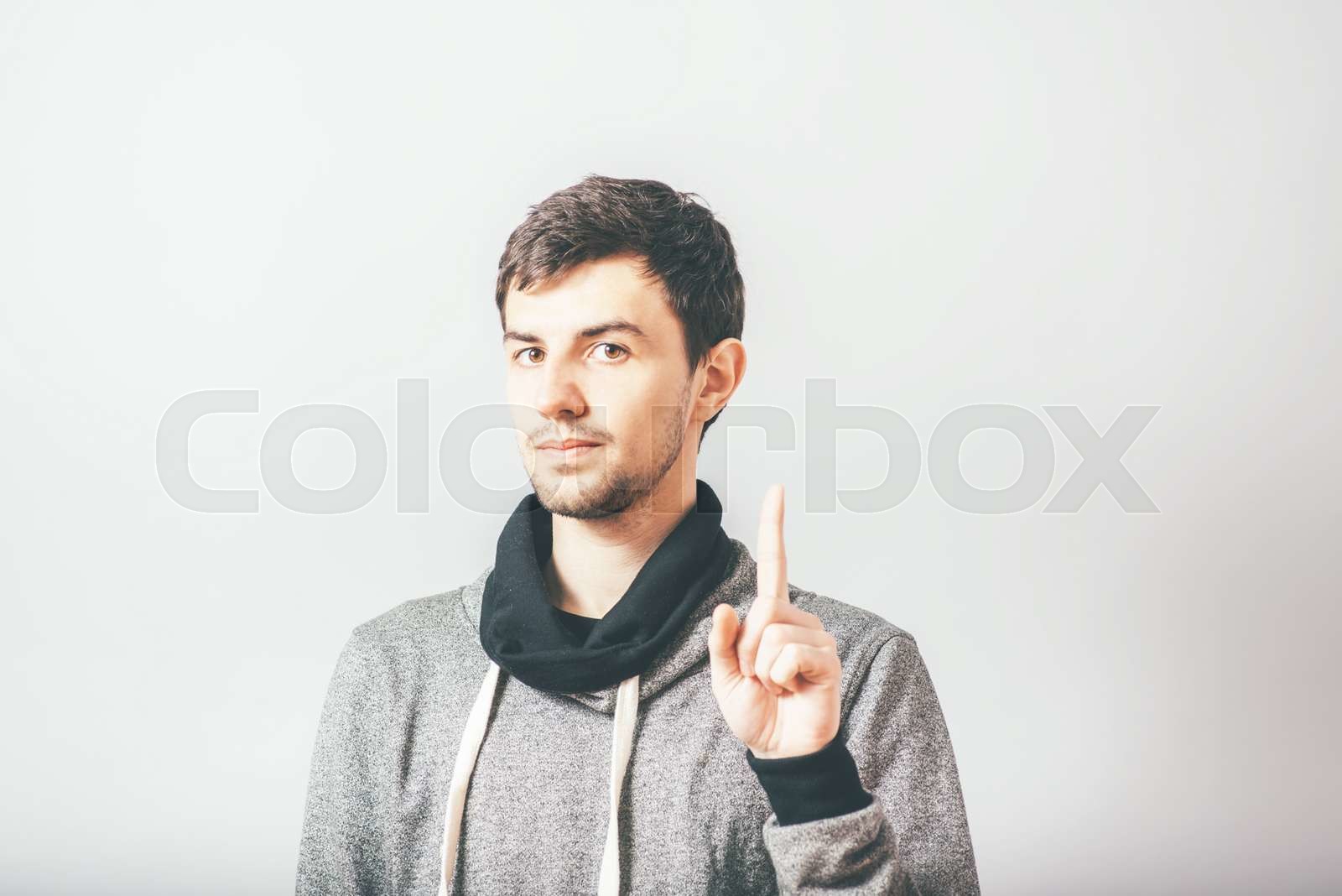guy shows up the index finger | Stock image | Colourbox