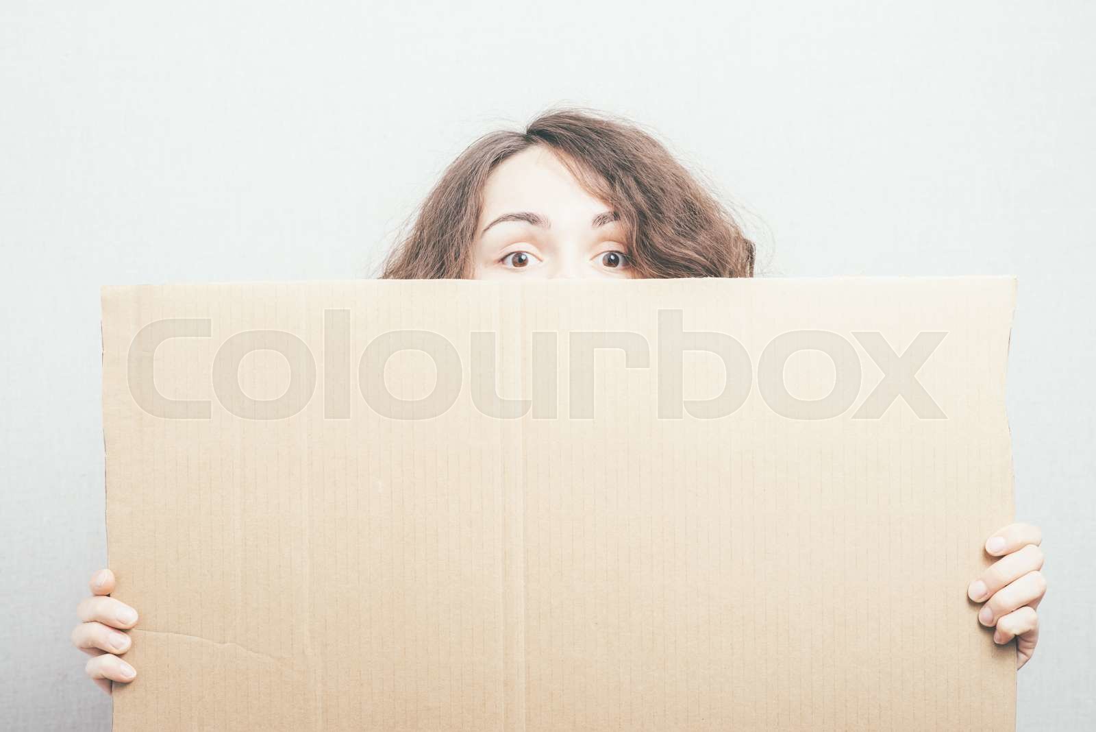 girl holding a paper | Stock image | Colourbox