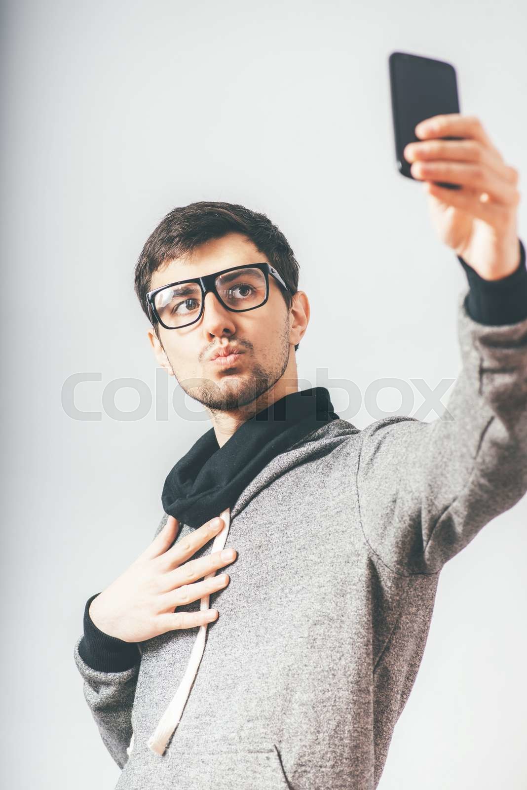 man photographing himself on the phone | Stock image | Colourbox