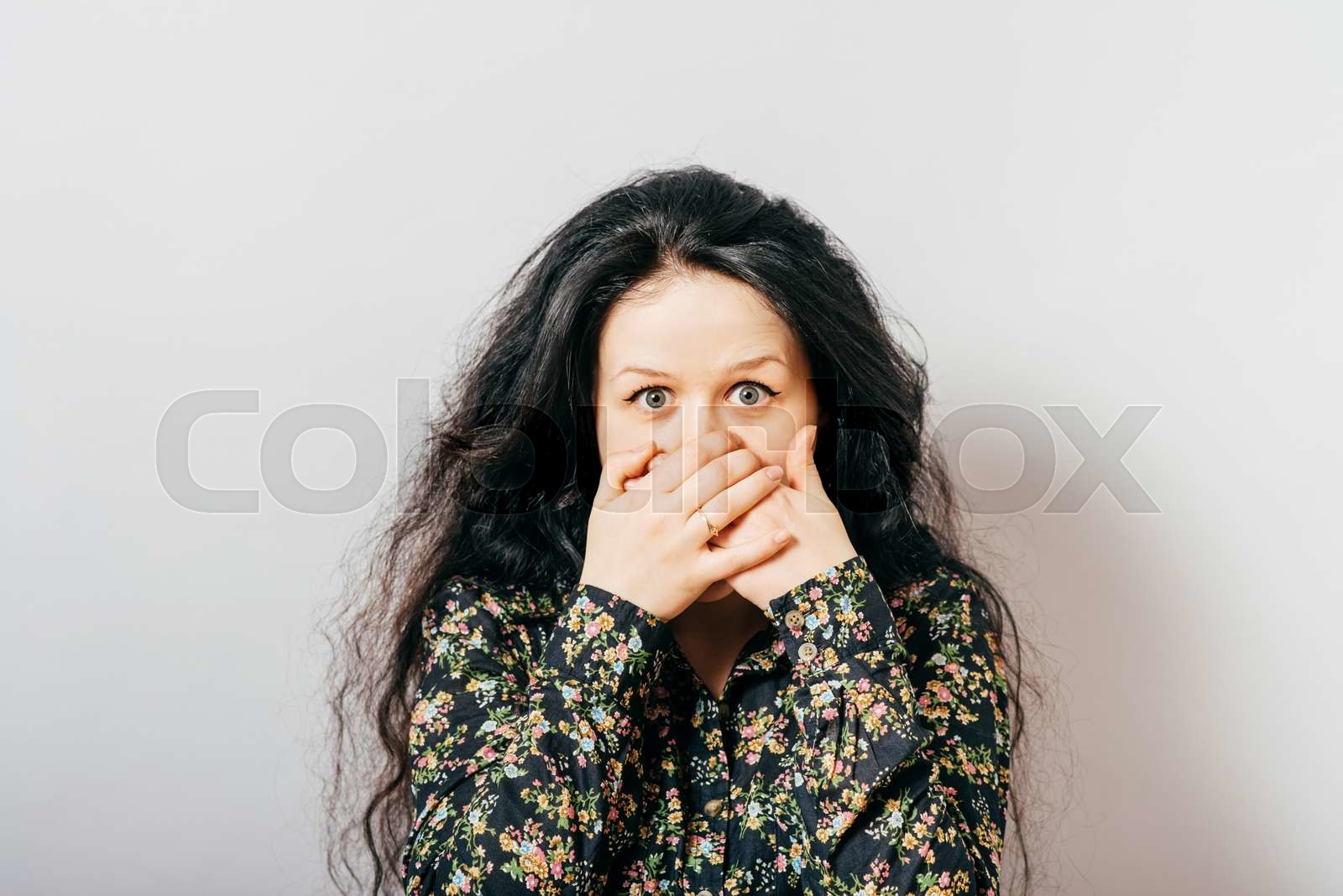 beautiful long-haired girl scared | Stock image | Colourbox