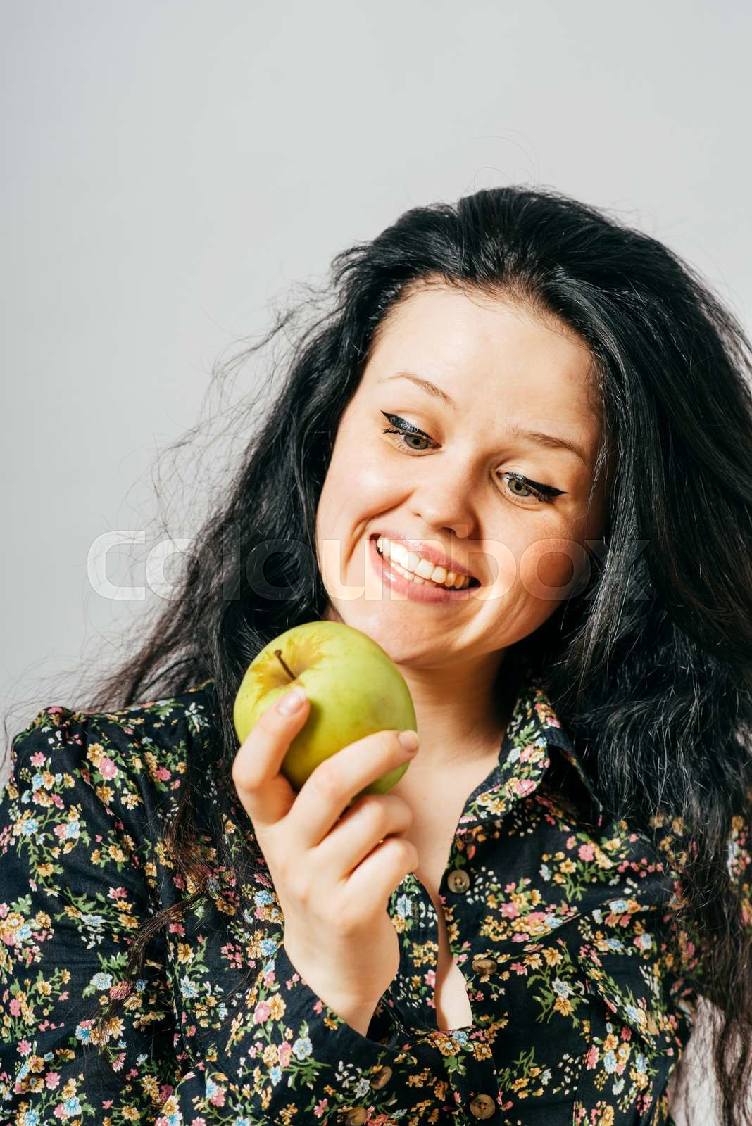 girl holding an apple | Stock image | Colourbox