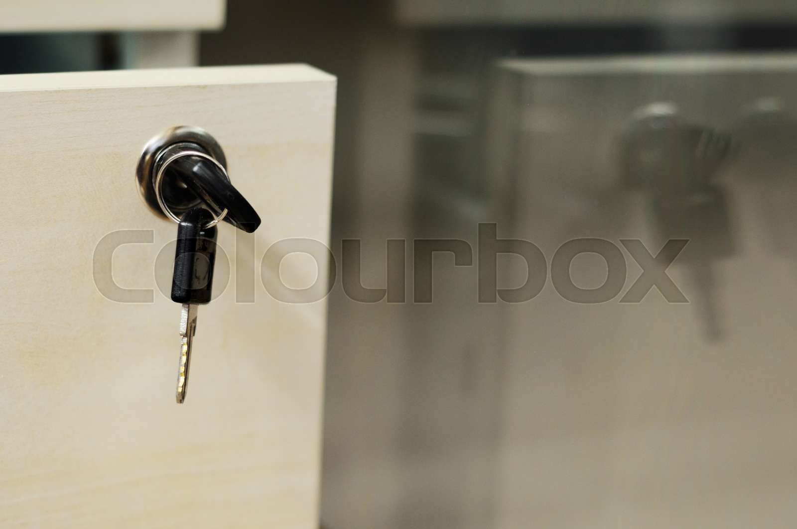 Opened locking drawer with keys | Stock image | Colourbox