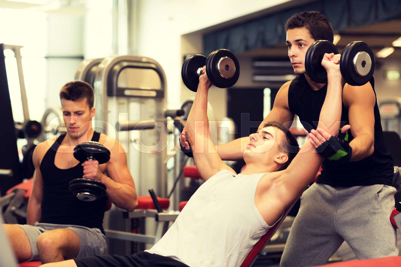 group of men with dumbbells in gym | Stock image | Colourbox