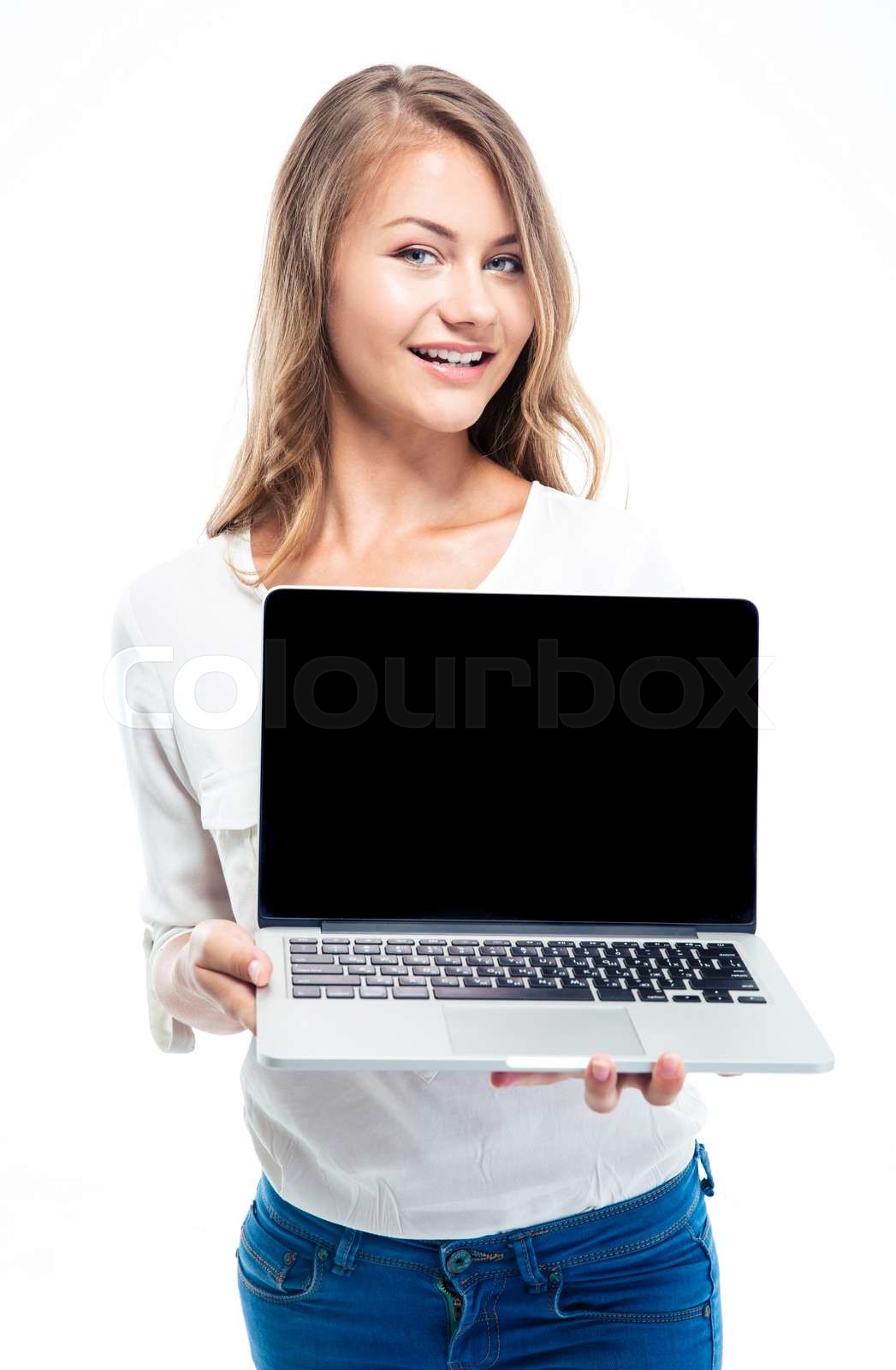 Girl showing laptop screen | Stock image | Colourbox