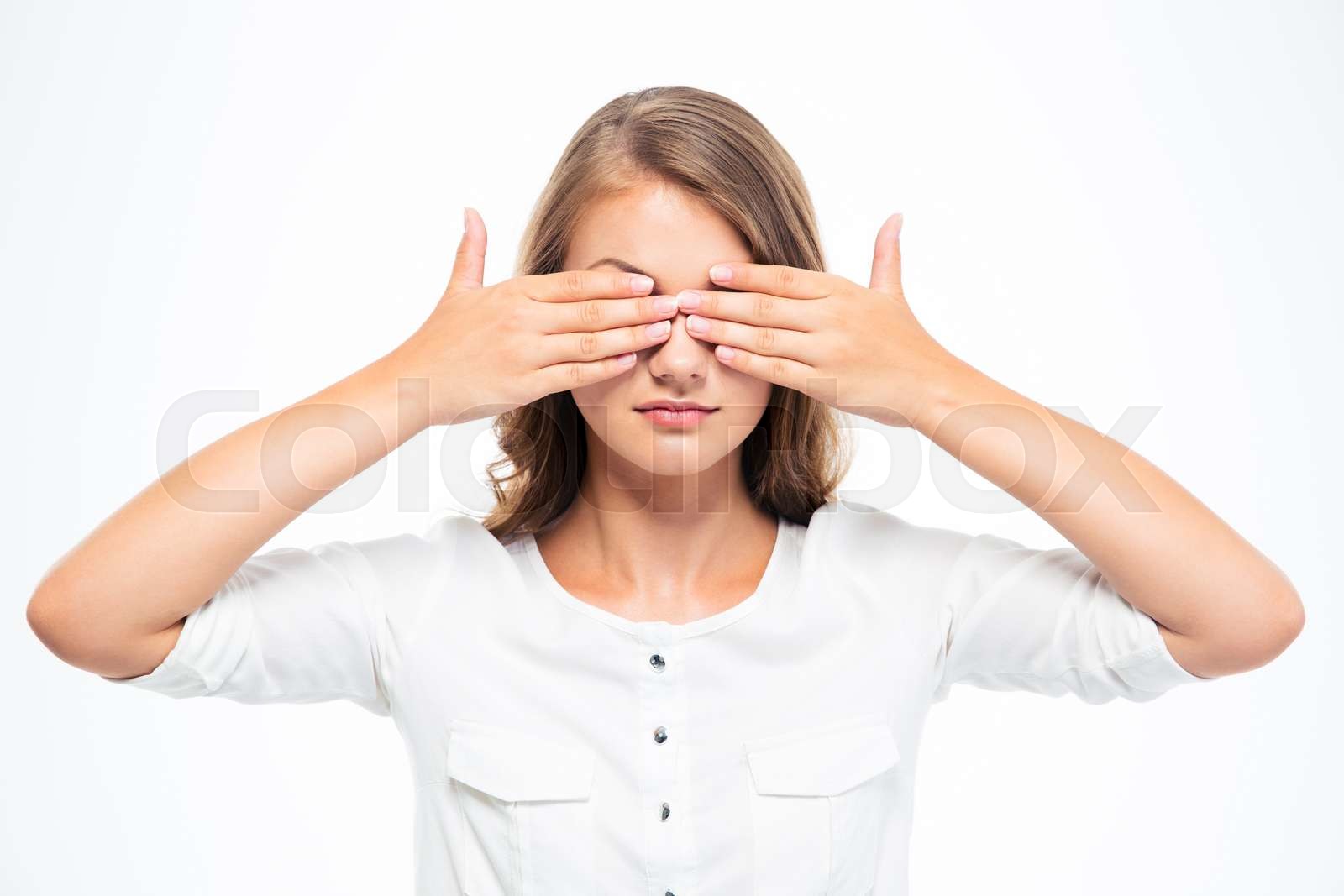 Young woman covering her eyes | Stock image | Colourbox