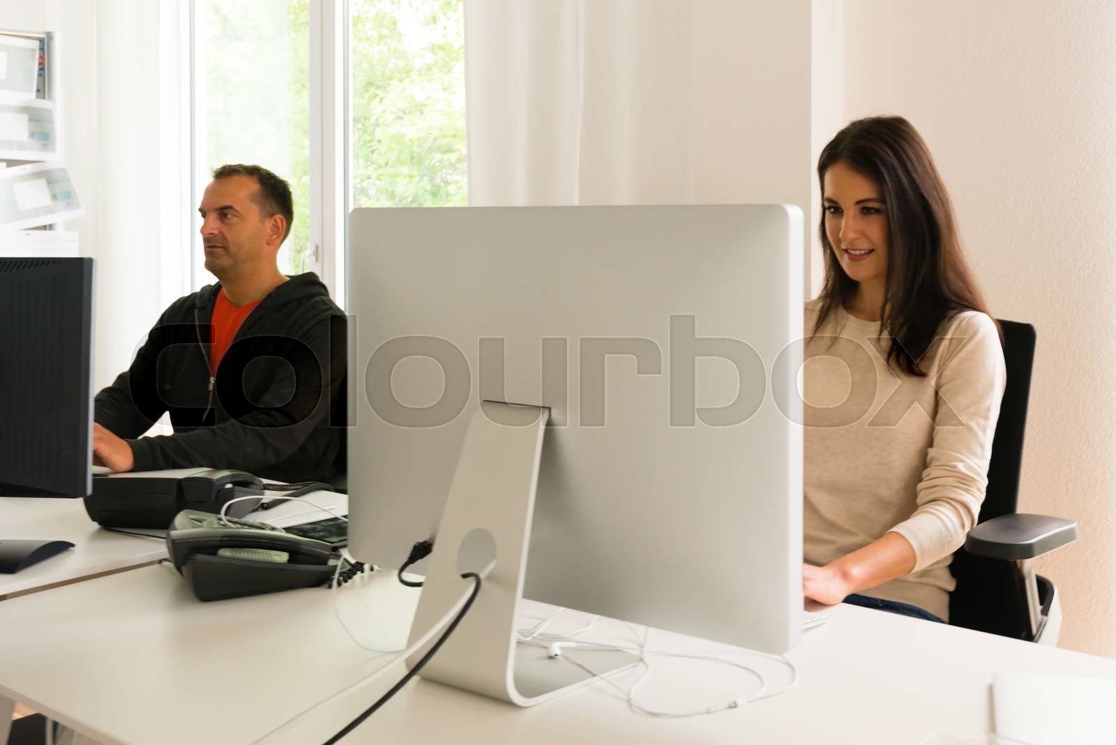 Office people being absorbed in their work | Stock image | Colourbox