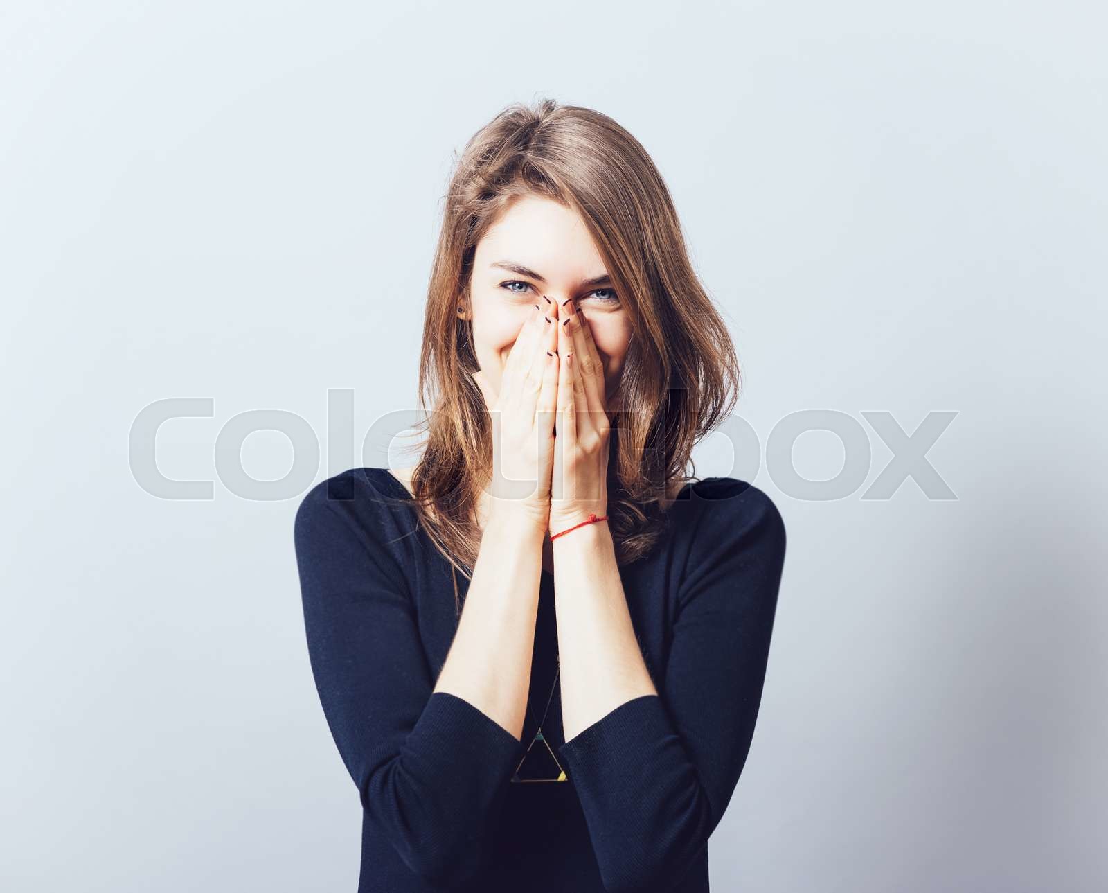 Beautiful Young Woman Covering The Face With Her Hand Stock Image