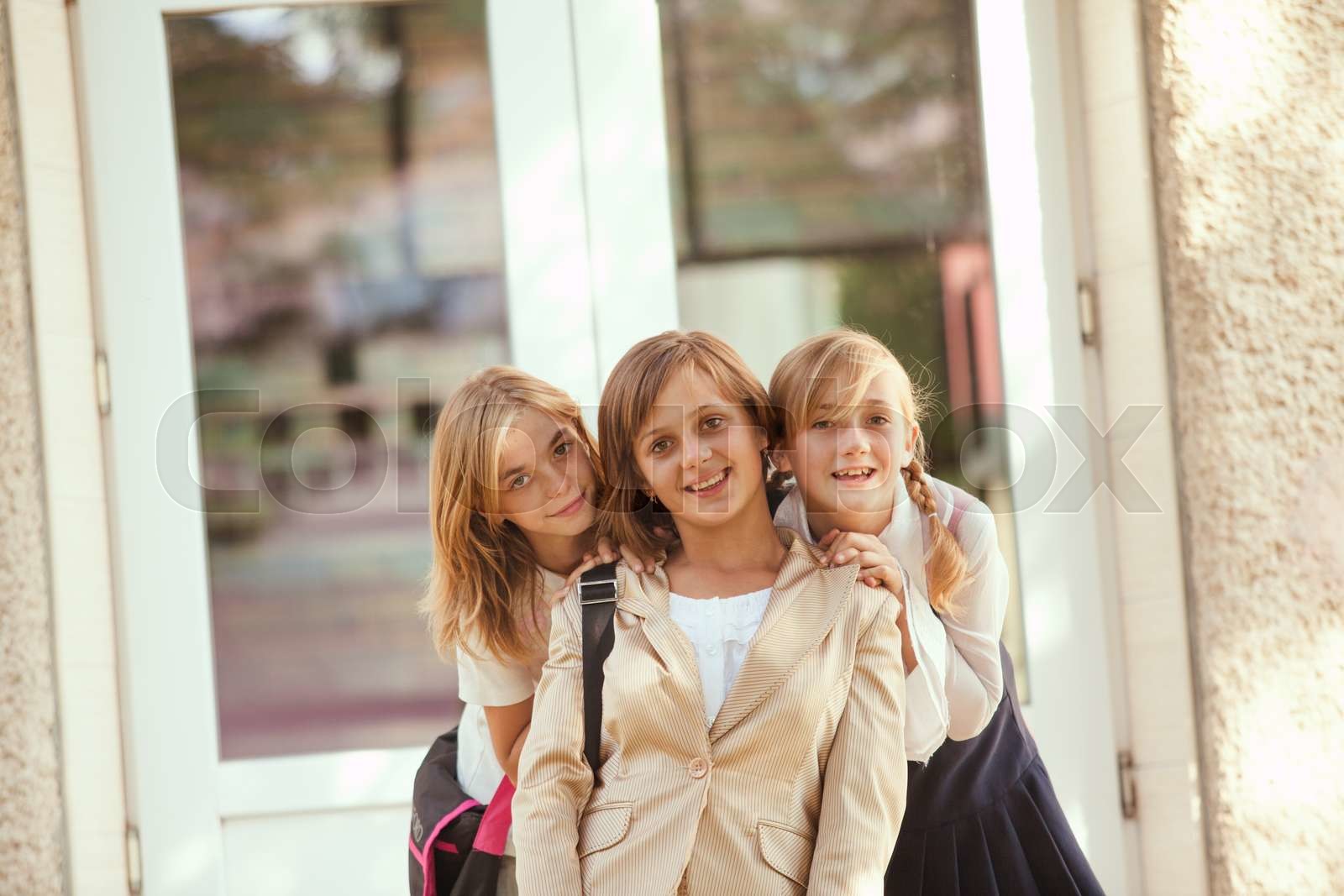 Three schoolgirls | Stock image | Colourbox