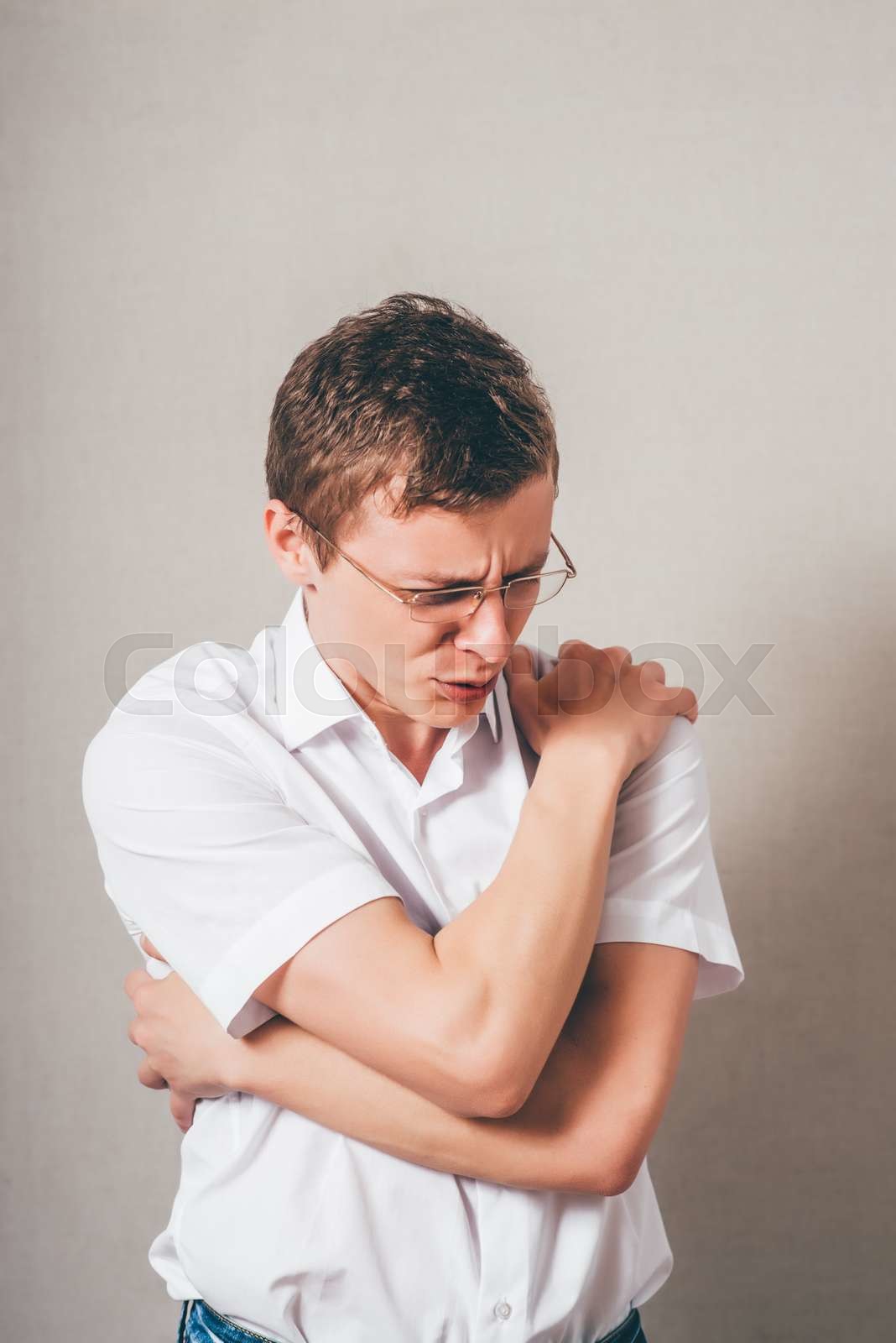 Young man with feeling cold | Stock image | Colourbox