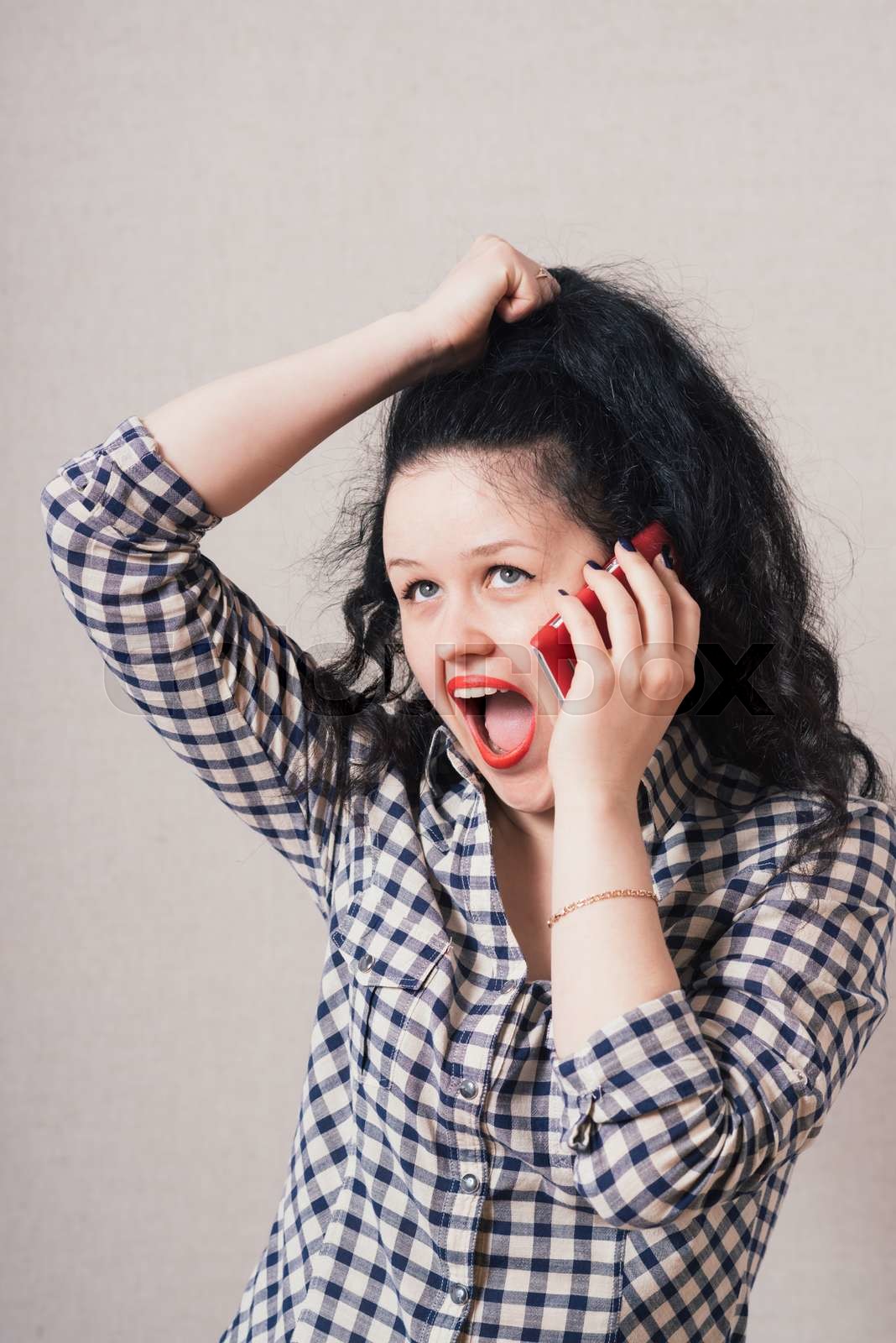 girl screaming in mobile phone | Stock image | Colourbox