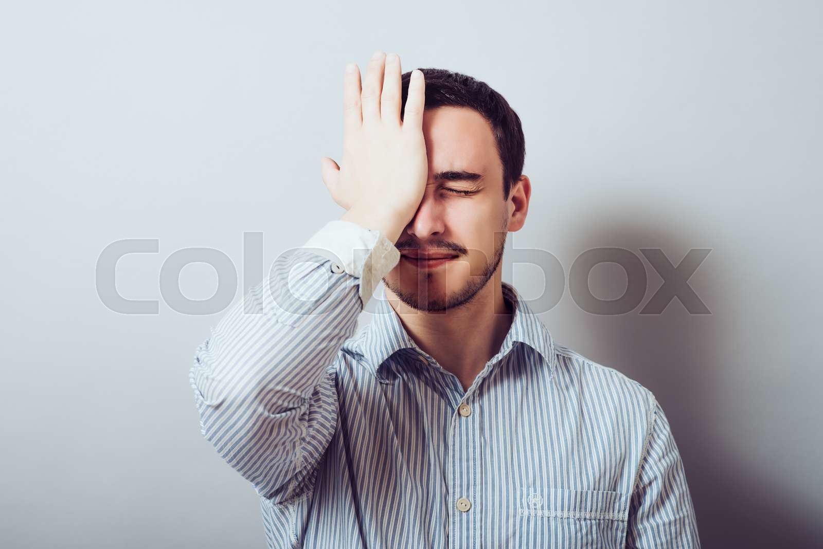 of young man thinking daydreaming worried deeply about something, uh oh ...