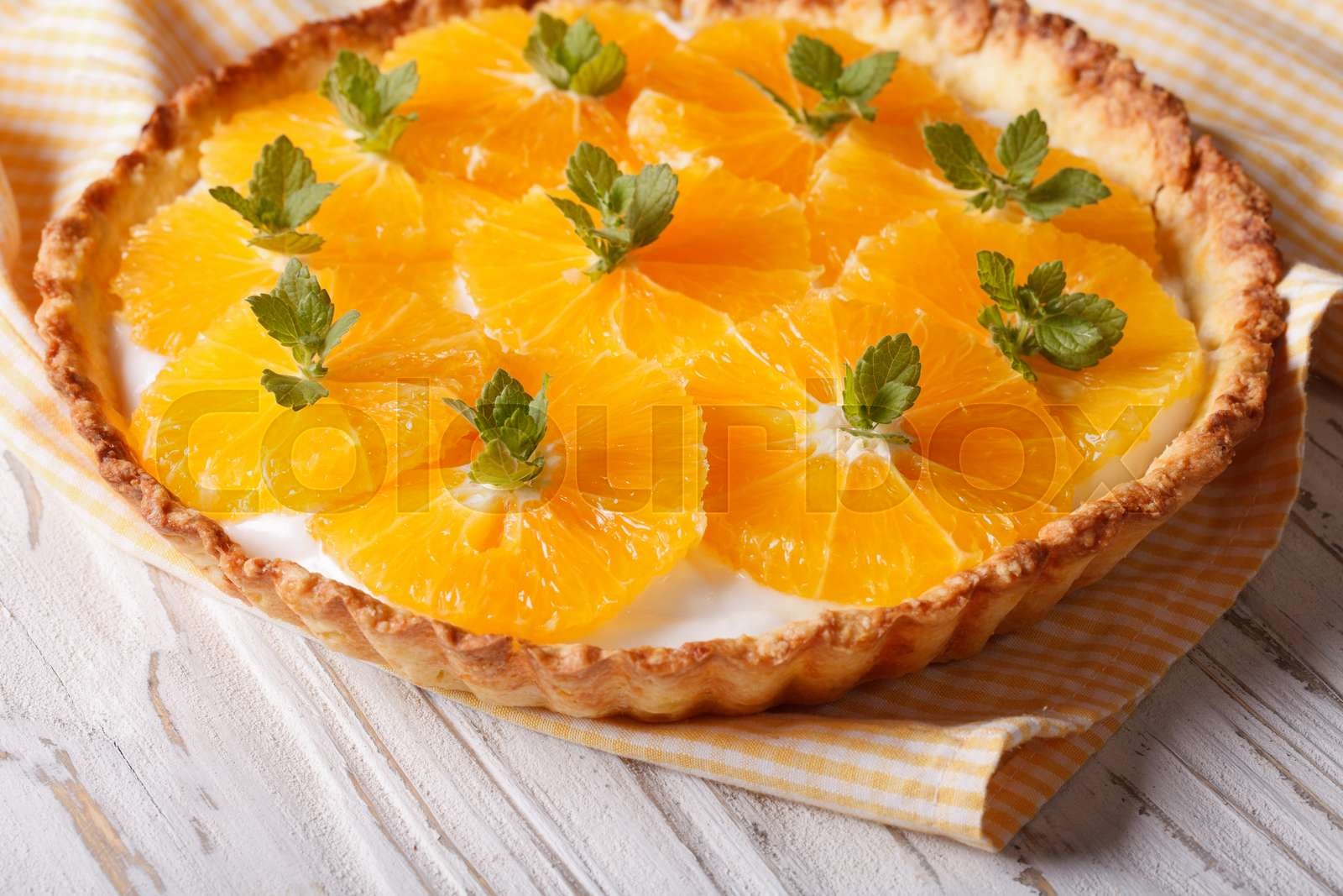 Orange tart with a delicious cream close-up horizontal | Stock image ...