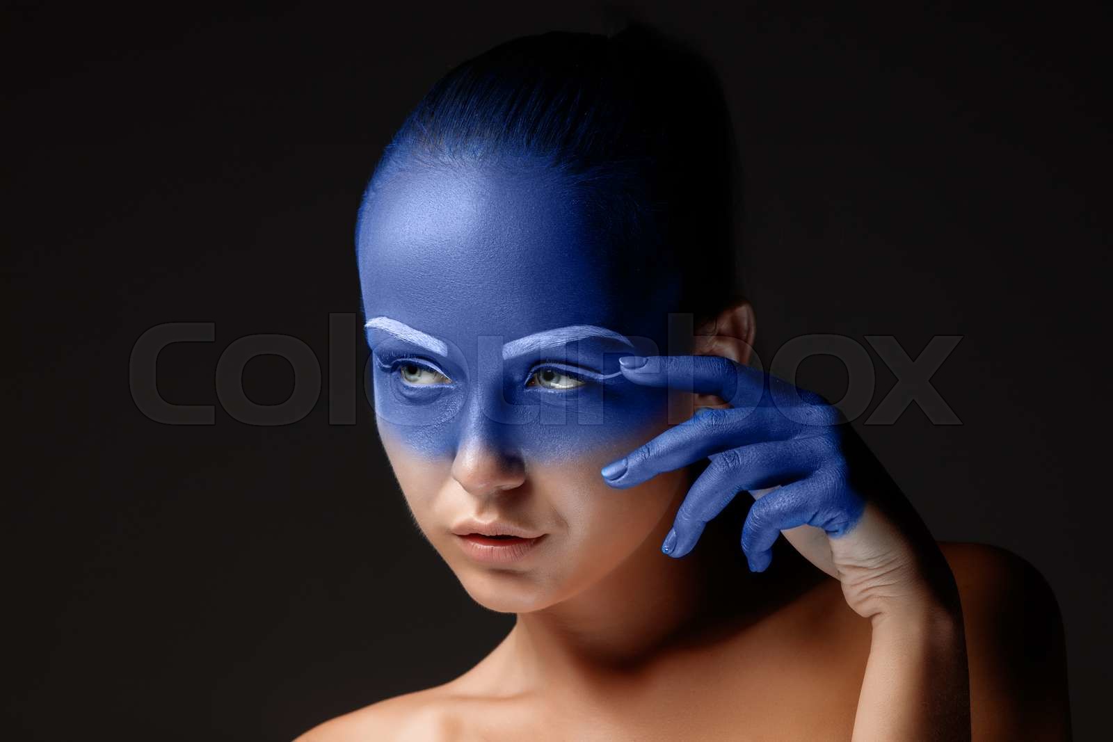 Portrait of a woman who is posing covered with blue paint | Stock image ...