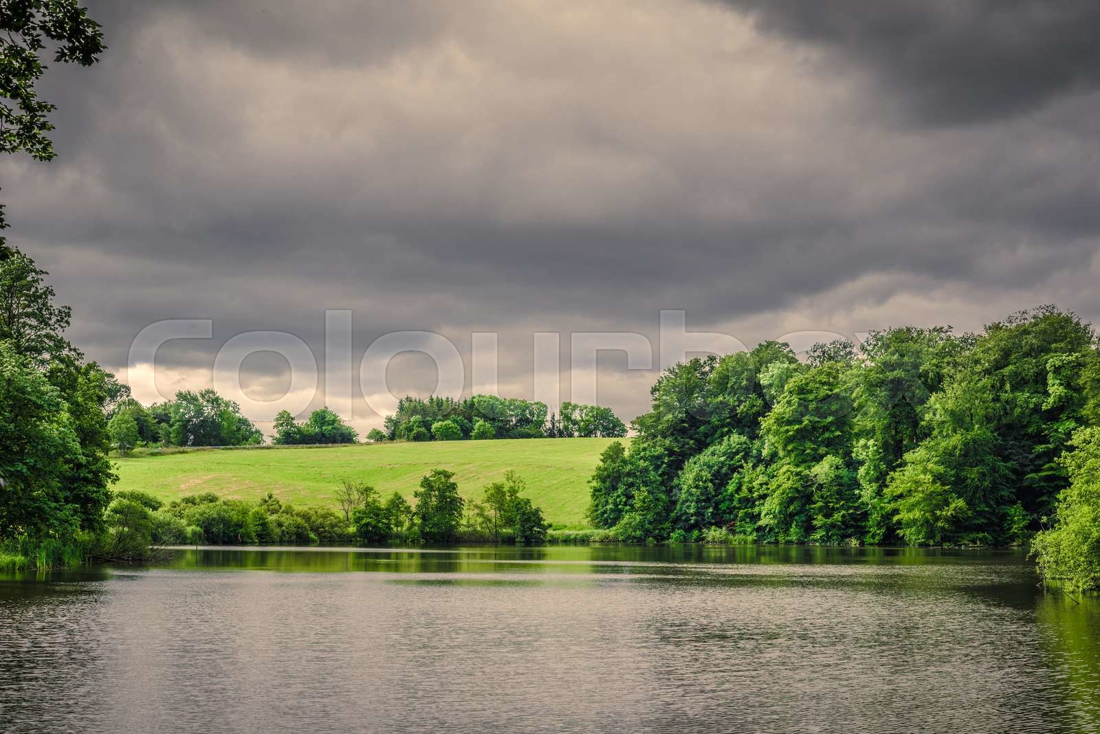 Lake scenery in dark cloudy weather | Stock image | Colourbox