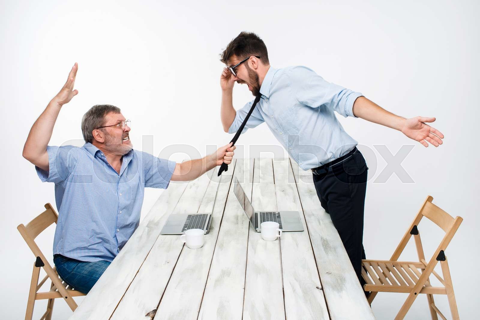 Business conflict. The two men expressing negativity while one man ...