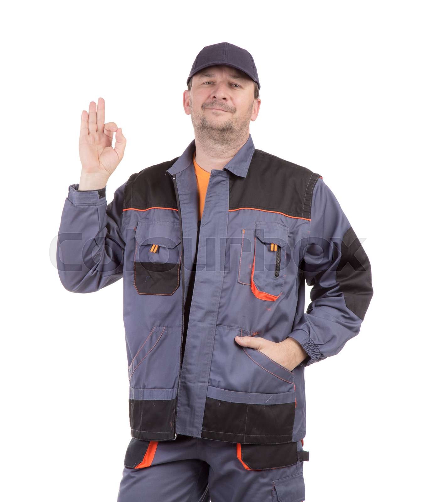 Working man smiling with ok sign. | Stock image | Colourbox