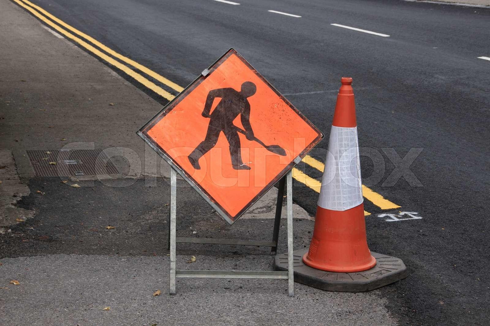Road sign, work in progress and a standing cone sign. | Stock image ...