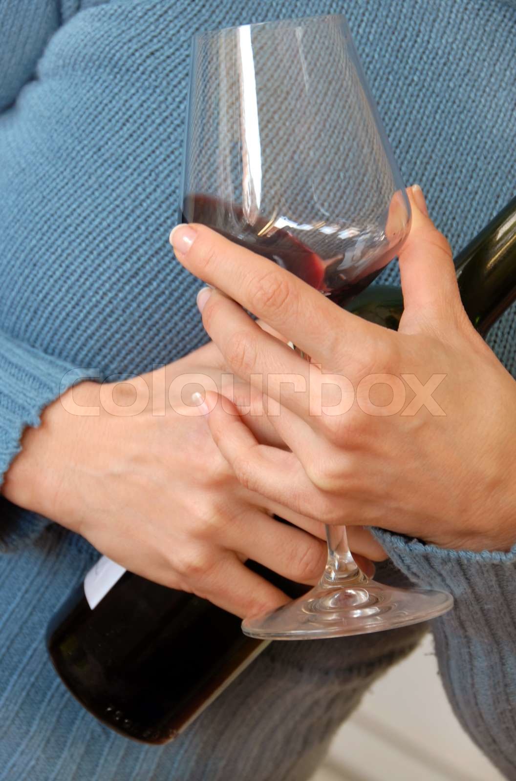 wine glass and bottle in woman's hug | Stock image | Colourbox