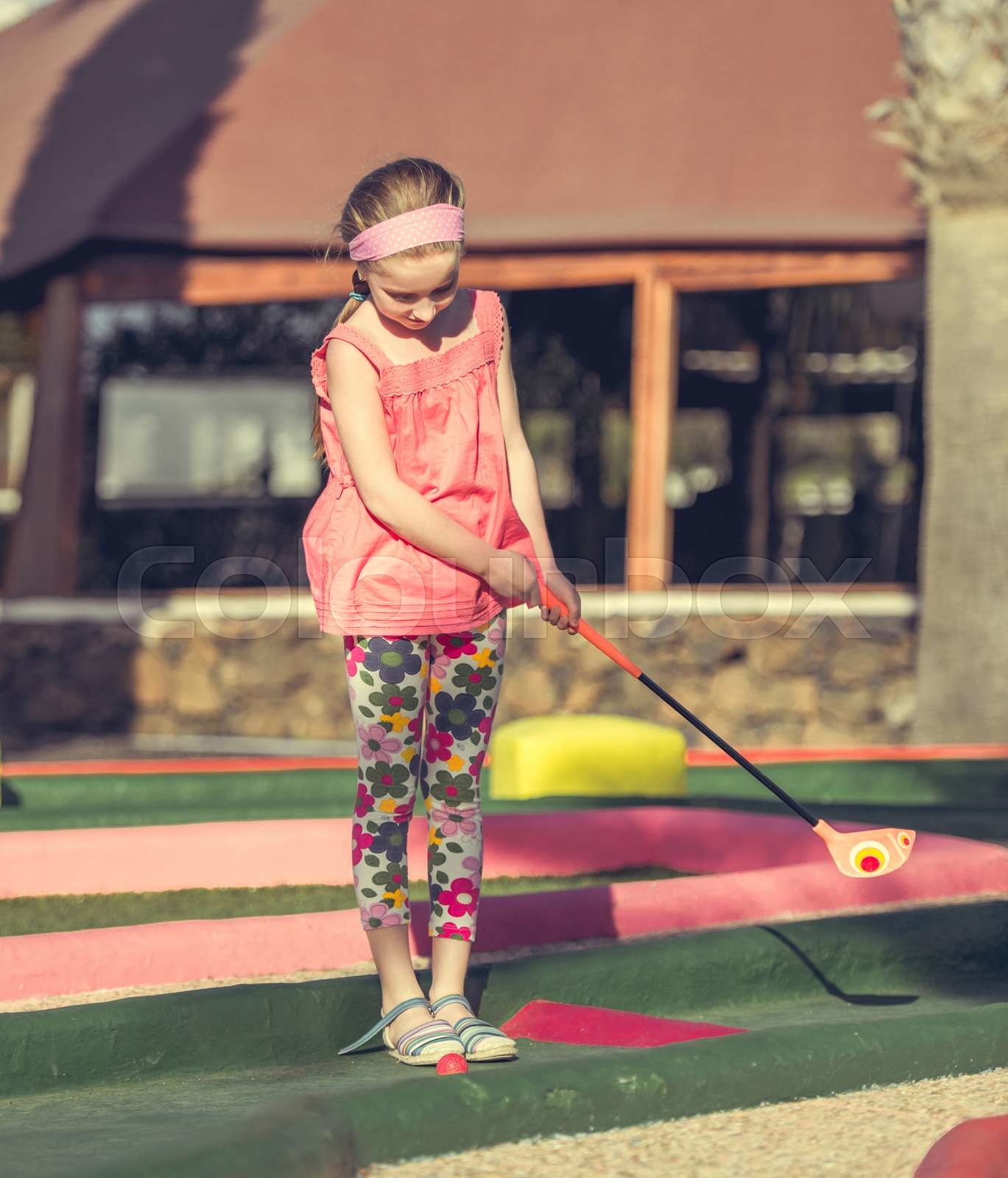 little girl playing golf | Stock image | Colourbox