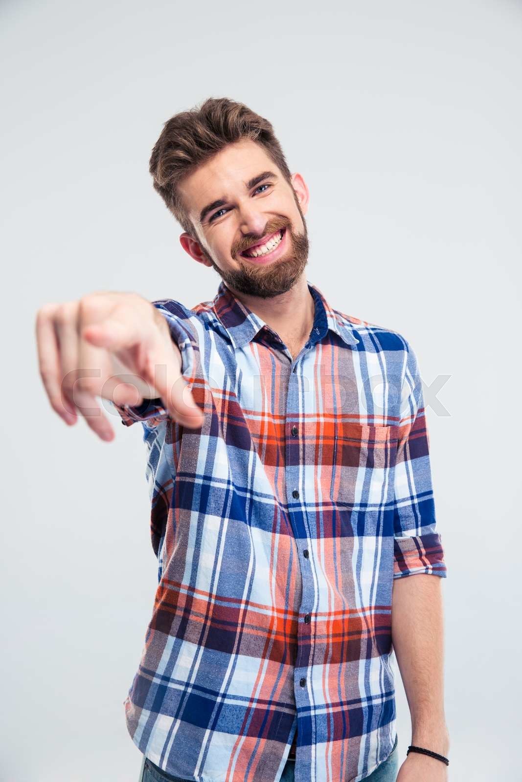 Happy man pointing finger at camera | Stock image | Colourbox