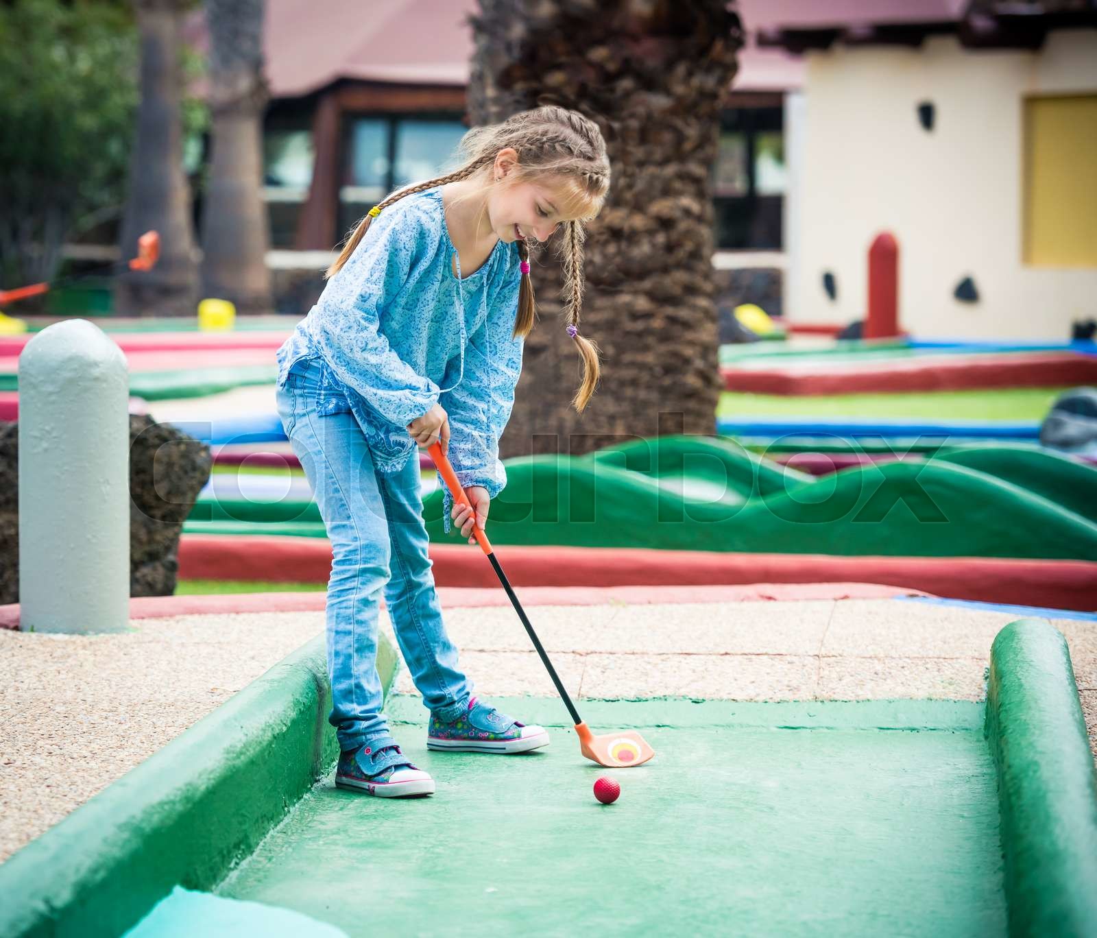 little girl playing golf | Stock image | Colourbox