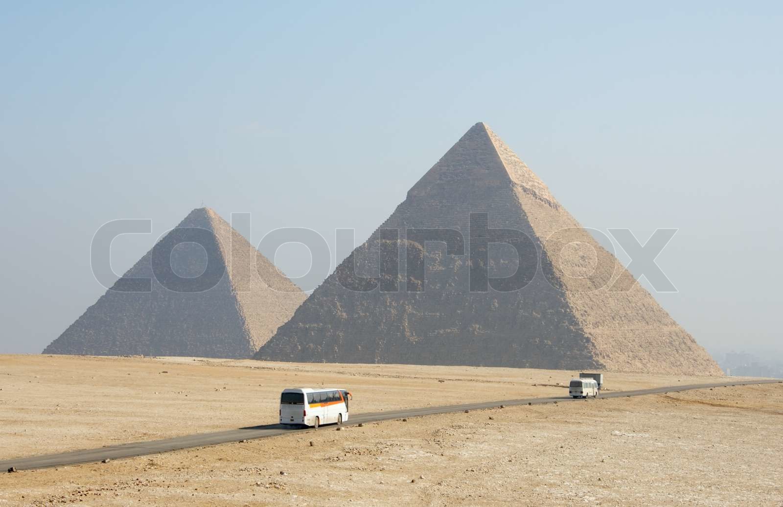 egypt pyramids in Sahara desert and road with bus | Stock image | Colourbox