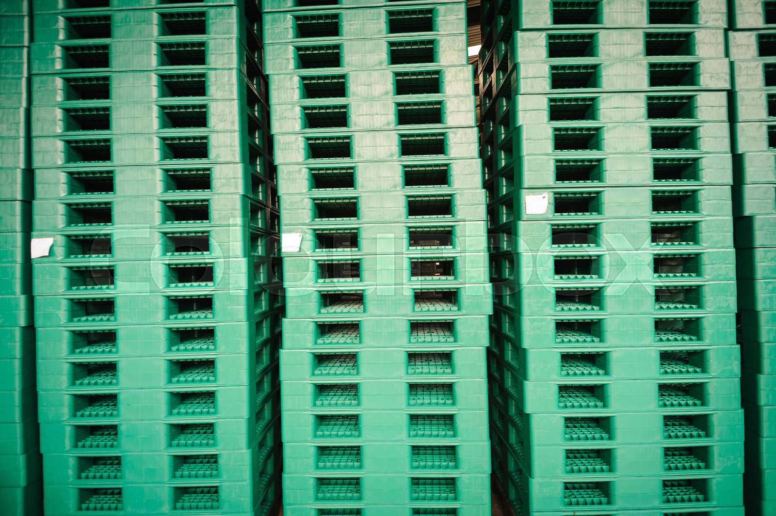 Green plastic pallets in warehouse. | Stock image | Colourbox