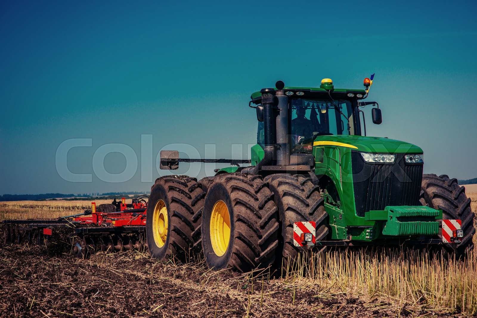tractors working in the field | Stock image | Colourbox
