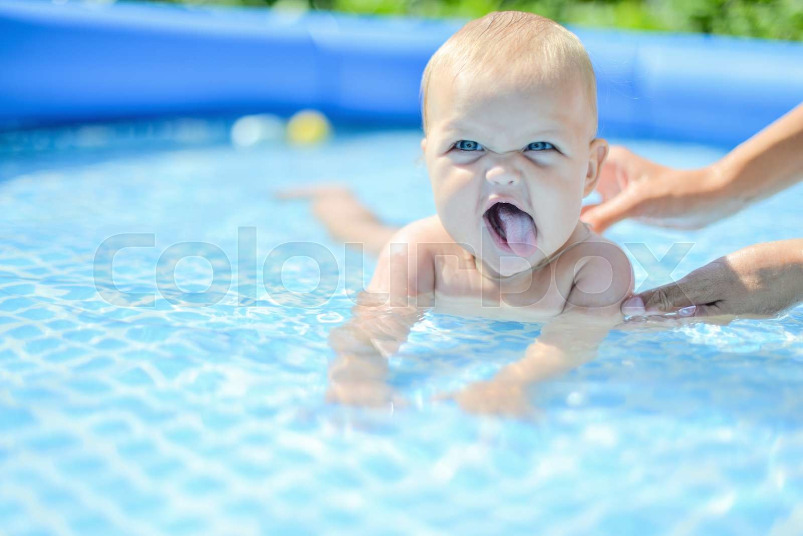 little baby in the water pool | Stock image | Colourbox
