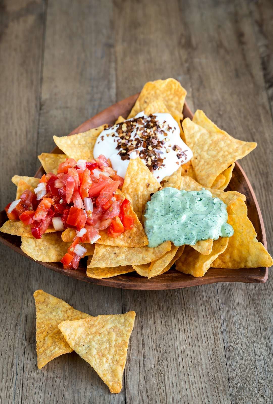 Cheese nachos with different types of sauce | Stock image | Colourbox