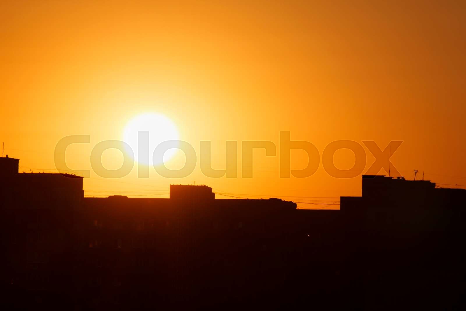 rising sun above building | Stock image | Colourbox
