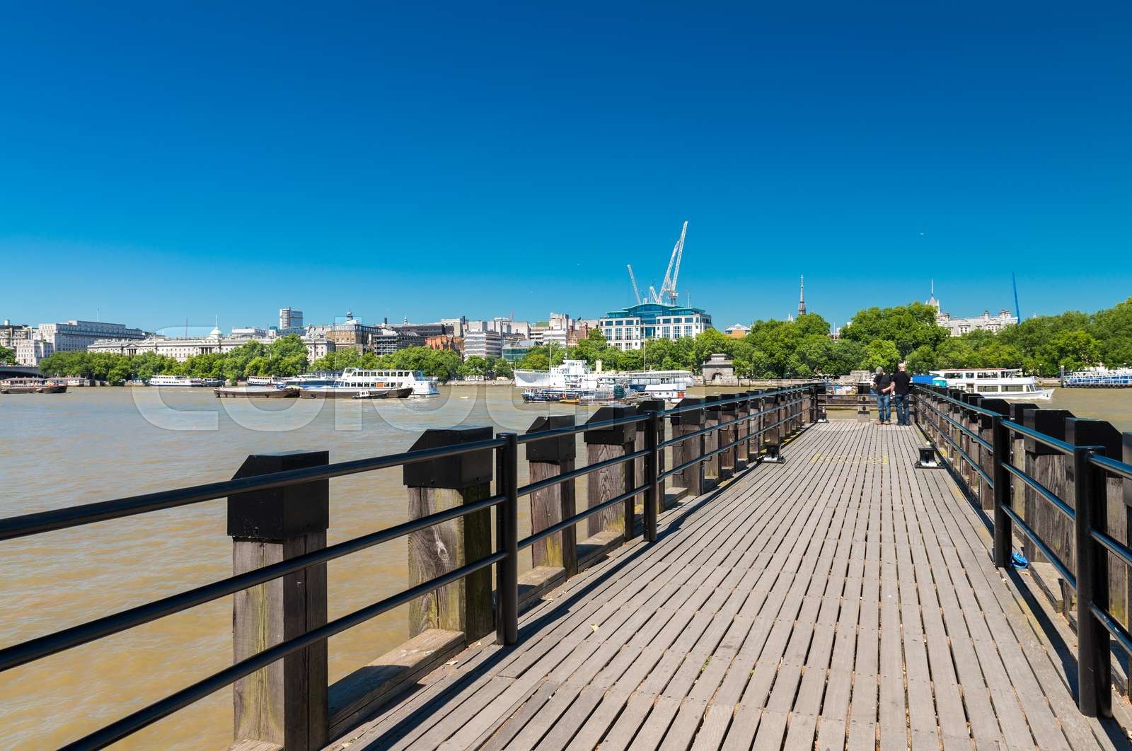 London. Jetty over Thames river on a beautiful day | Stock image ...