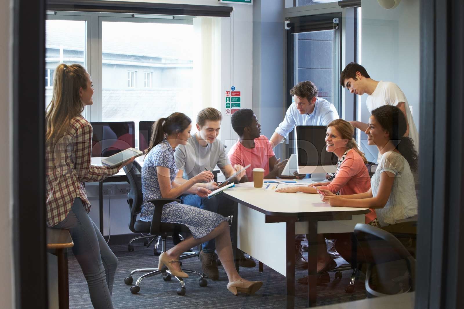 College Students Having Informal Meeting With Tutors | Stock image ...