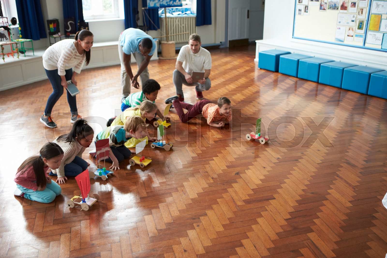 Group Of Children Carrying Out Experiment In Science Class | Stock ...
