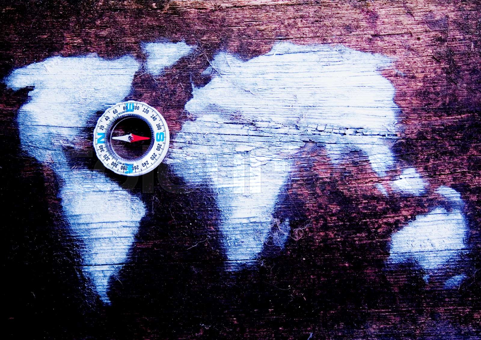 Modern world and compass on desk | Stock image | Colourbox