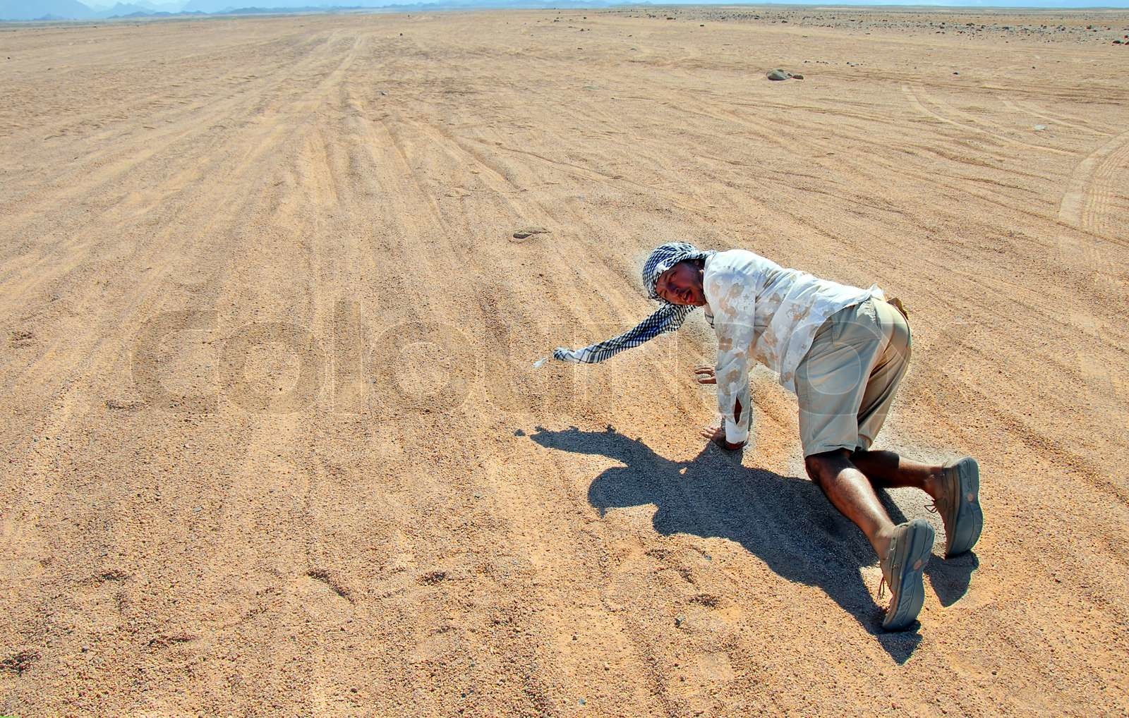 Man Crawling In Desert