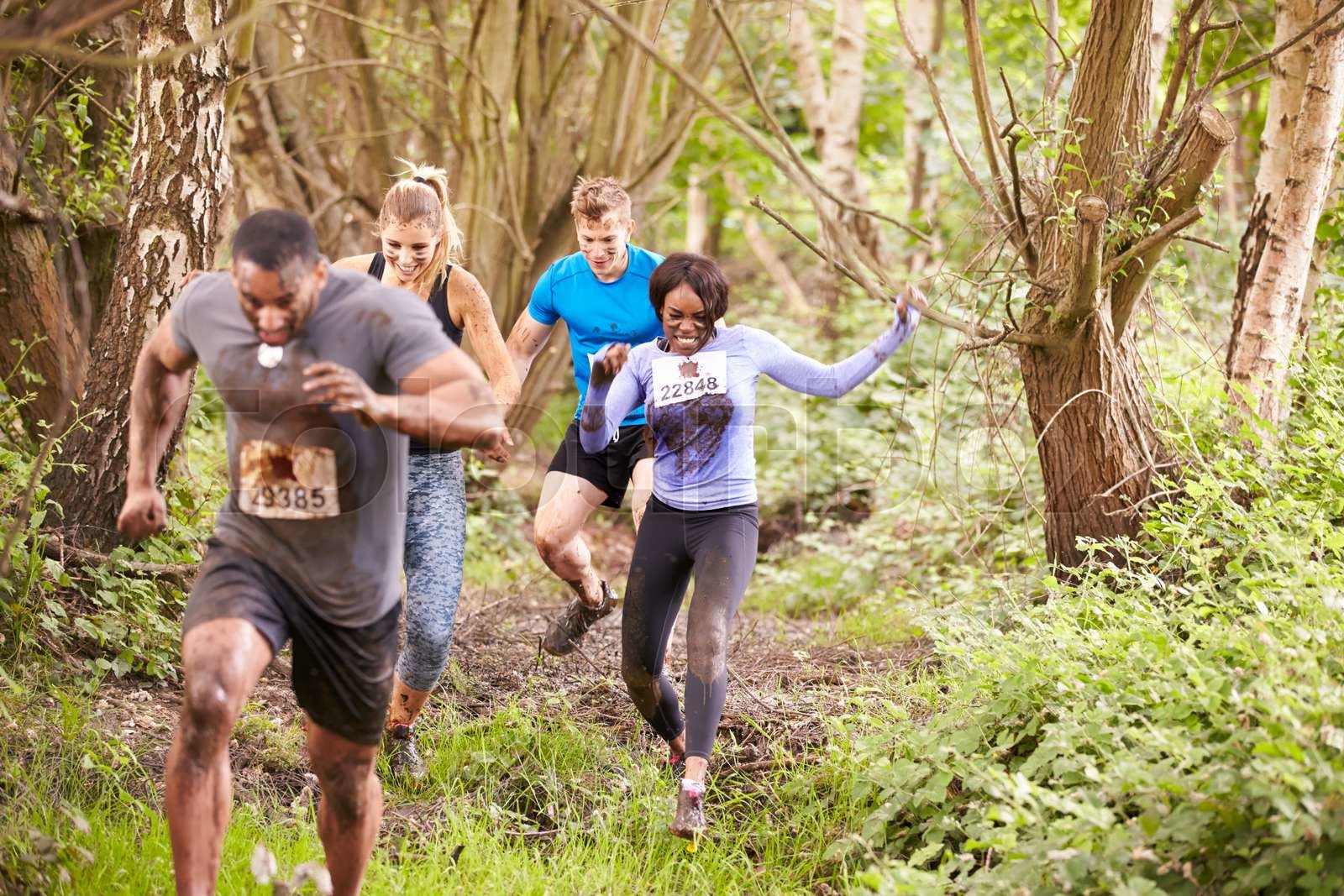 Competitors running in a forest at an endurance event | Stock image ...