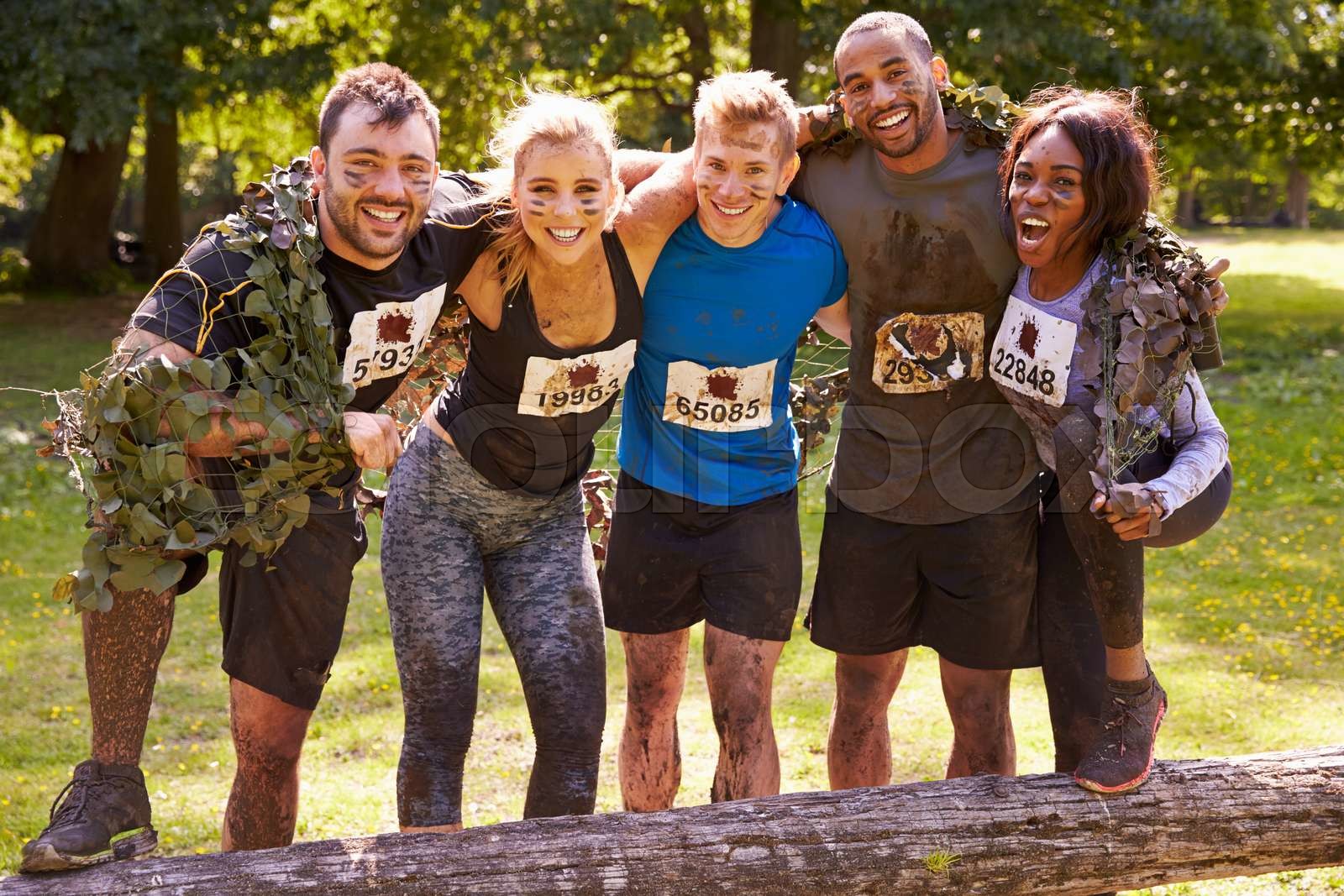 Competitors Celebrate Completing An Extreme Endurance Event Stock competitors-celebrate-completing-an-extreme-endurance-event-stock
