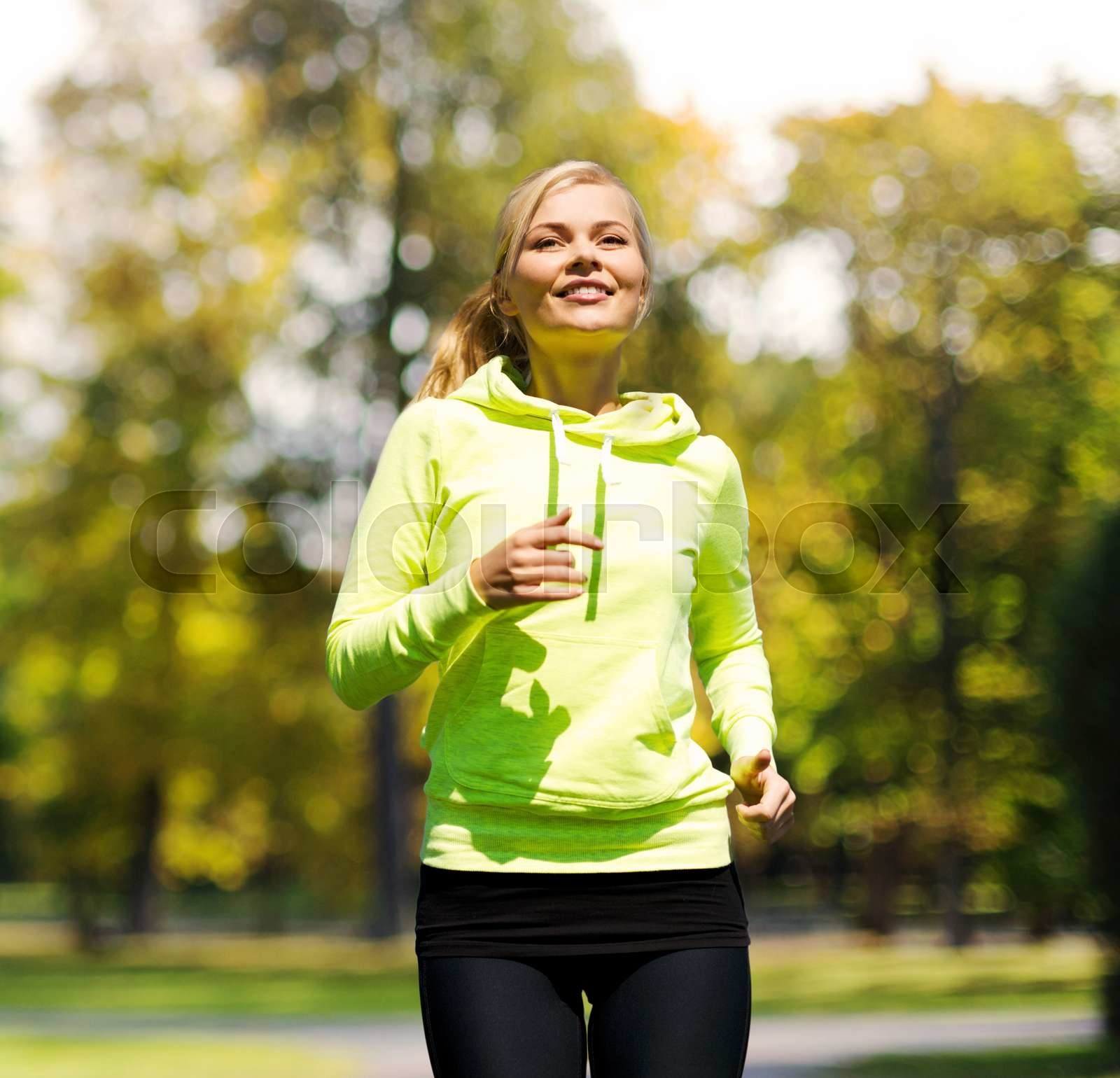 woman jogging outdoors | Stock image | Colourbox