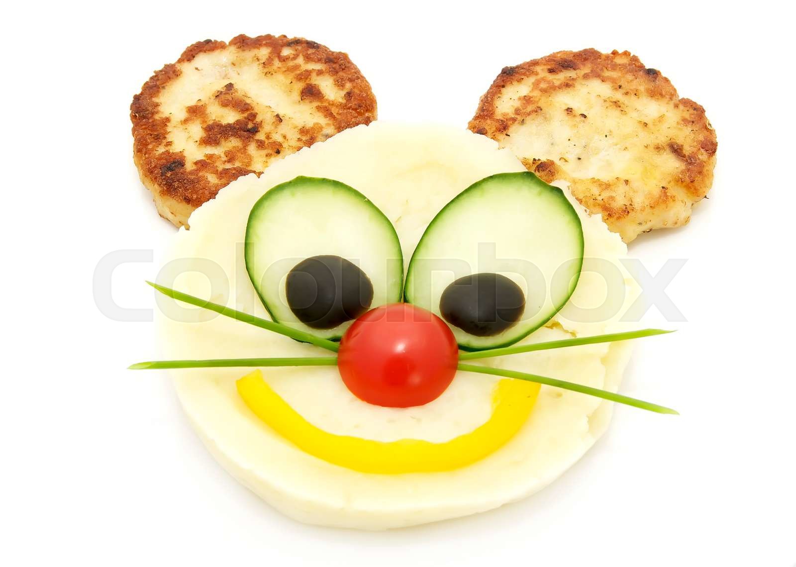 mashed potatoes in a mouse with ears of the chops | Stock image | Colourbox