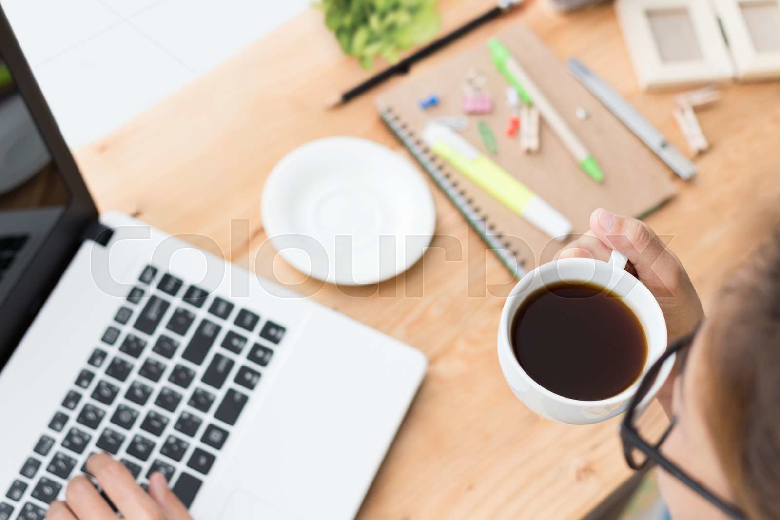 woman drink coffee and use laptop computer on desk | Stock image ...