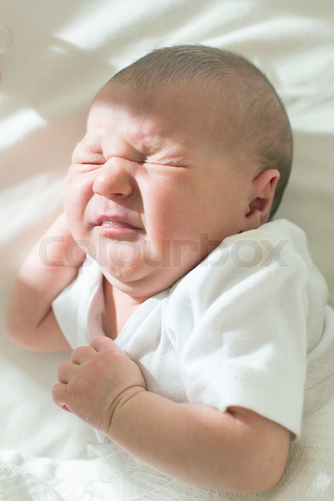 Frowning baby | Stock image | Colourbox